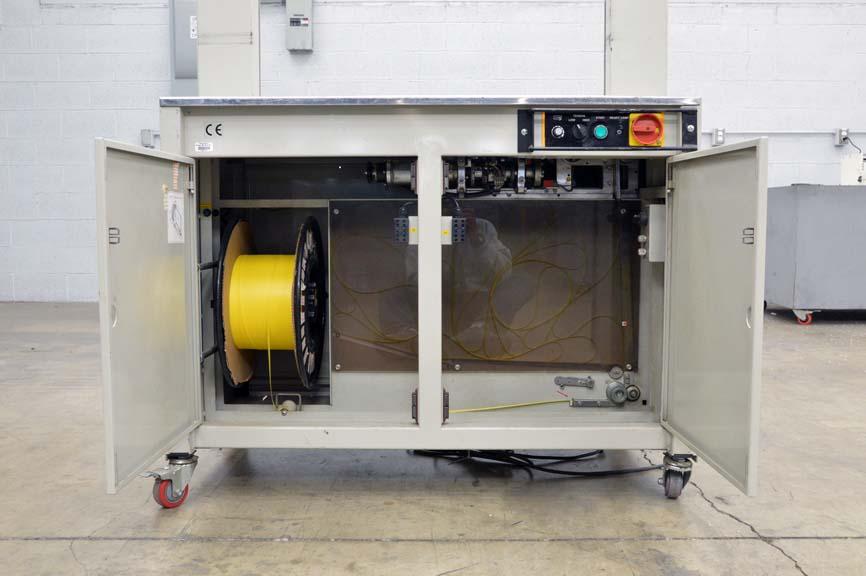 Lot #63: 2004 ITW Packaging (Omega) Strapping Machine - WireBids